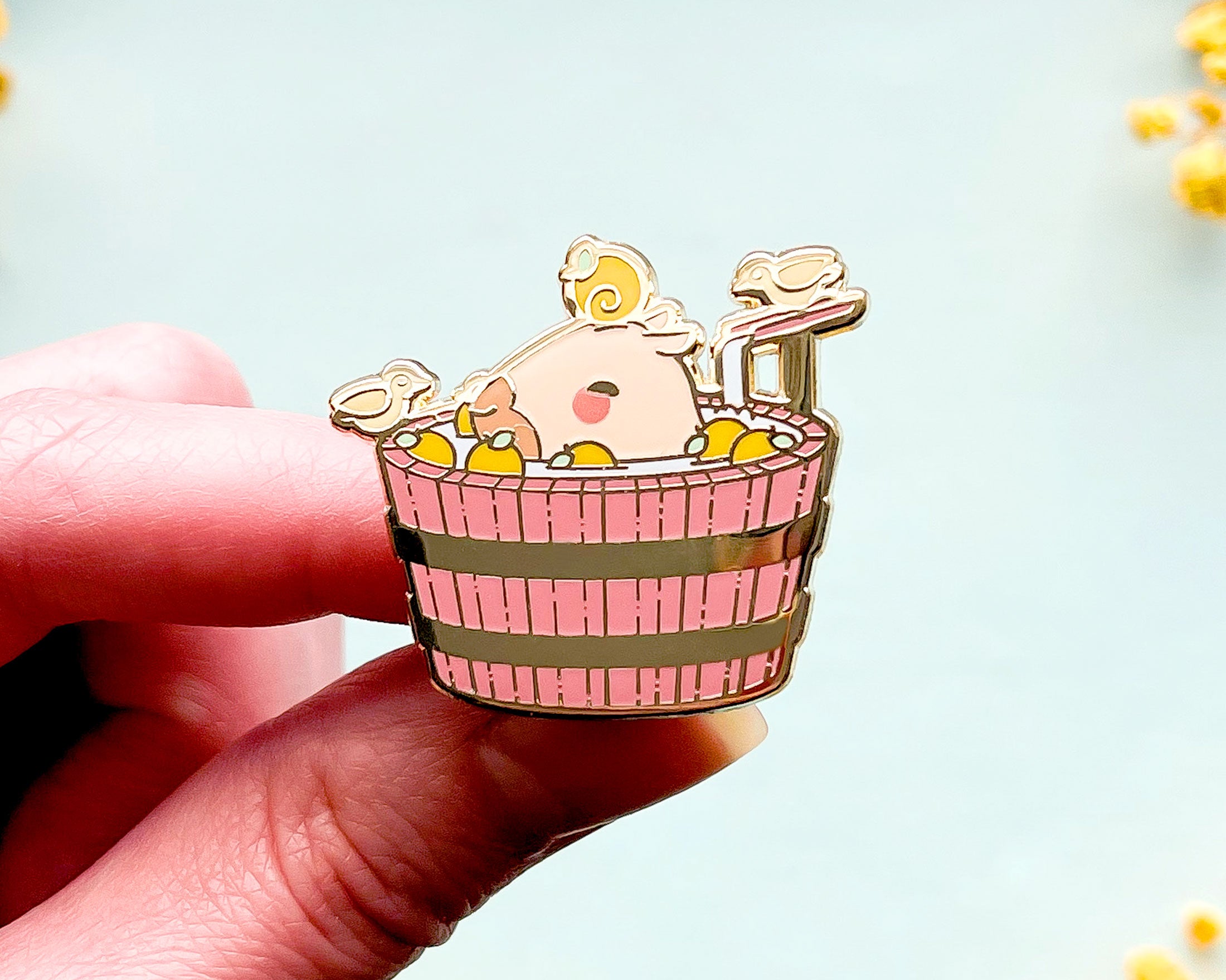 Curly the Capybara in a Bucket Spa Enamel Pin – Alum and Ink